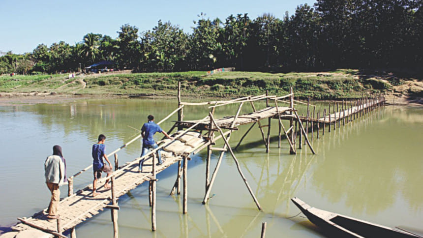 Risky bamboo bridge only means | The Daily Star