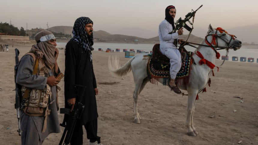 Taliban fighters enjoy rare day off at amusement park | The Daily Star