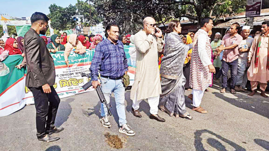 Gun-toting man in front of AL procession in Nandail | The Daily Star